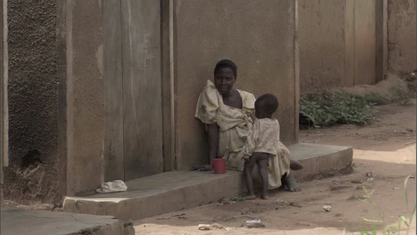 mother sitting on stoop child uganda Stock Footage Video (100% Royalty ...