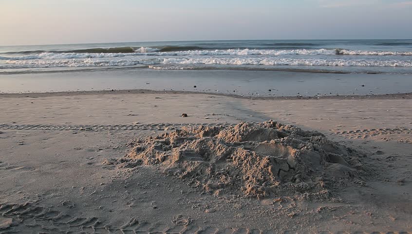 waves washing on shore yesterday's sandcastle Stock Footage Video (100% ...