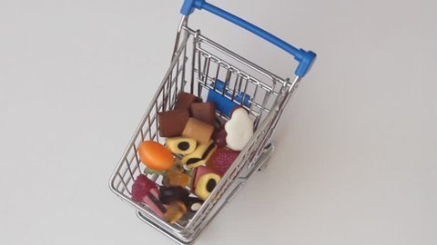 Rotating Shopping Cart Falling Sweets Stock Footage Video (100% Royalty ...