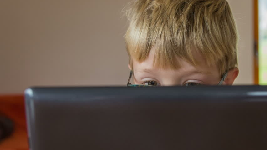 Kid with Glasses Behind Computer Stock Footage Video (100% Royalty-free ...