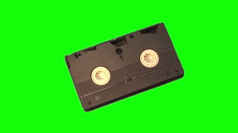 Videocassette VHS girando en pantalla verde: video de stock (totalmente ...