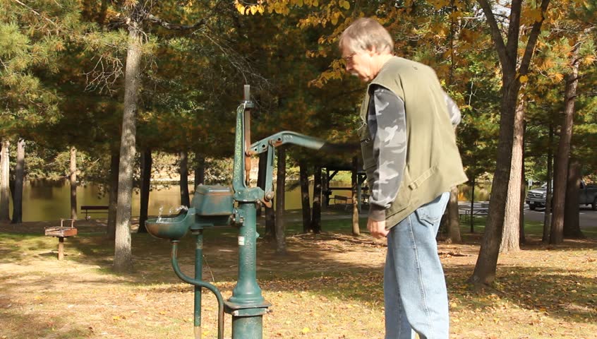 Man Pumping Water from an Stock Footage Video (100% Royalty-free ...