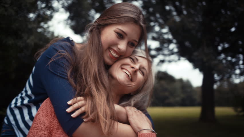 Daughter Surprises Mother Loving Hug Behind Stock Footage Video 100