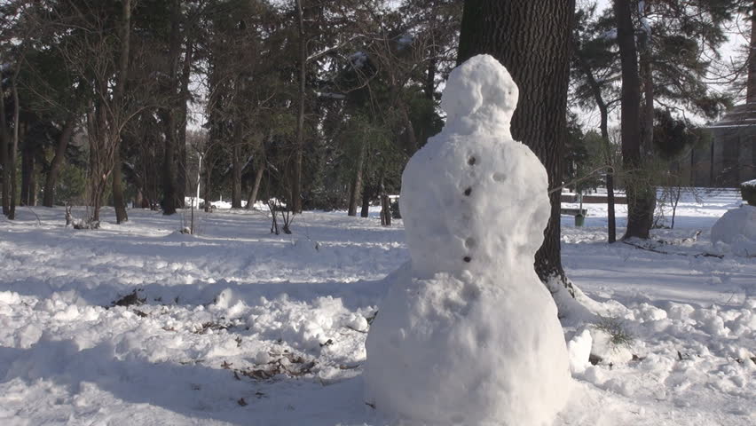 Children Throwing Snowballs in Snowman Stock Footage Video (100% ...