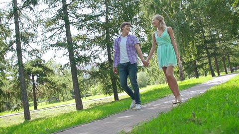 Slow Motion Sweethearts Striding Along Park Stock Footage Video (100% ...