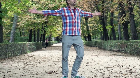Happy Man Turning Around Park During Stock Footage Video (100% Royalty ...