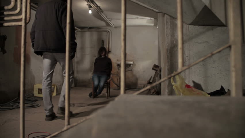 female hostage bag on head sitting Stock Footage Video (100% Royalty ...