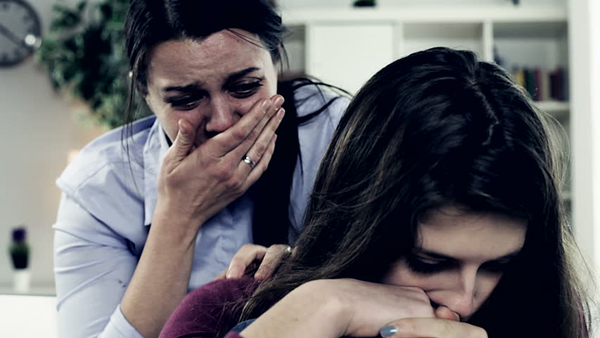 woman crying hugging teenager daughter after Stock Footage Video (100% ...