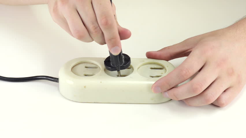 Inserting Plug Into Triple Outlet. Stock Footage Video (100% Royalty ...