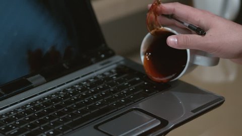 Spilling Coffee On Laptop Computer Slow Stock Footage Video (100% ...