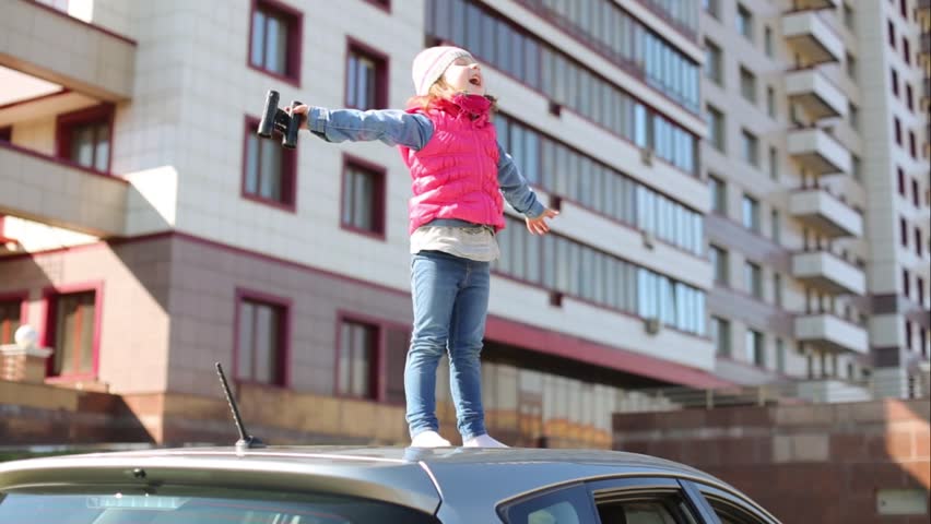 little girl standing on car roof Stock Footage Video (100% Royalty-free ...