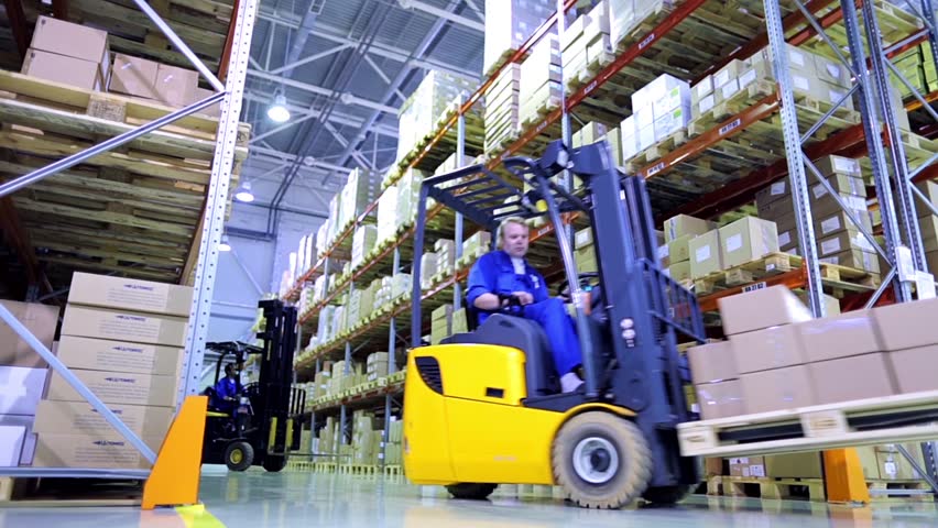 forklift trucks move between large metal Stock Footage Video (100% ...