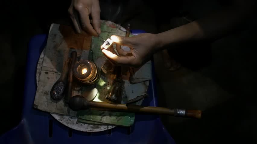 Man Preparing Opium Above Be Smoked Stock Footage Video (100% Royalty ...