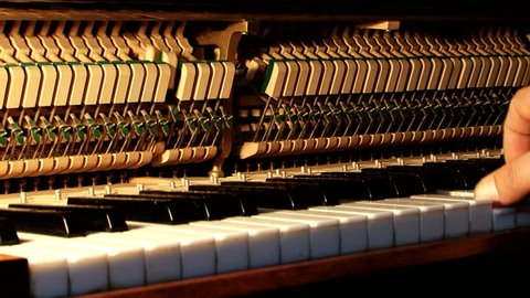 upright piano mechanism hammers striking strings Stock Footage Video ...