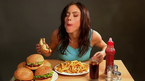 Woman Eating Fast Foodslim Girl Absorbs Stock Footage Video (100% ...