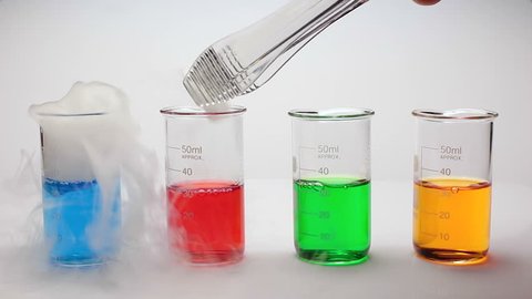 Putting Dry Ice Four Beakers Colored Stock Footage Video (100% Royalty ...