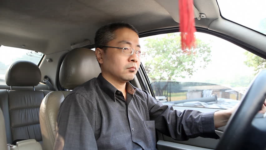 asian male driver drives carsunny dayreal Stock Footage Video (100% ...