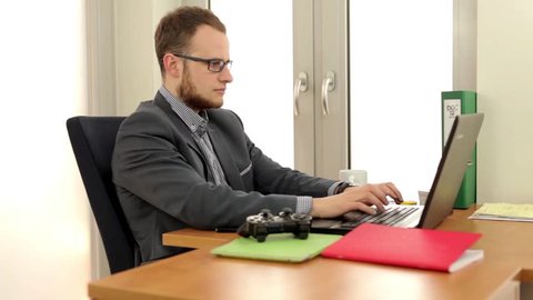 Young Handsome Man Sitting Behind Desk Stock Footage Video (100% ...