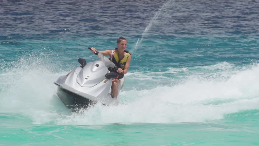 beautiful young woman rides jet ski Stock Footage Video (100% Royalty ...