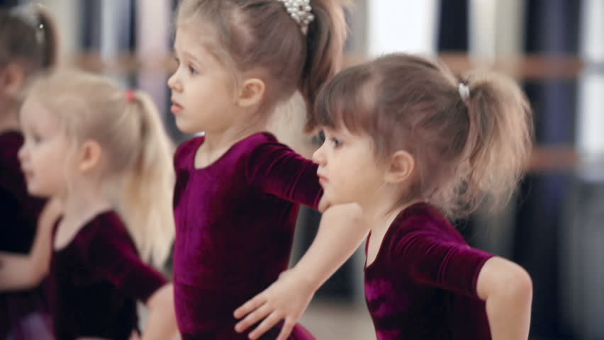 five little girls repeating choreography unskillfully Stock Footage ...