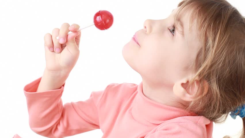 little girl eating red lollipop looks Stock Footage Video (100% Royalty ...