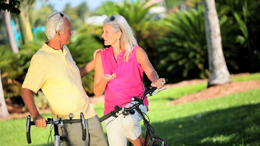 active senior people enjoying cycling outdoors Stock Footage Video (100 ...