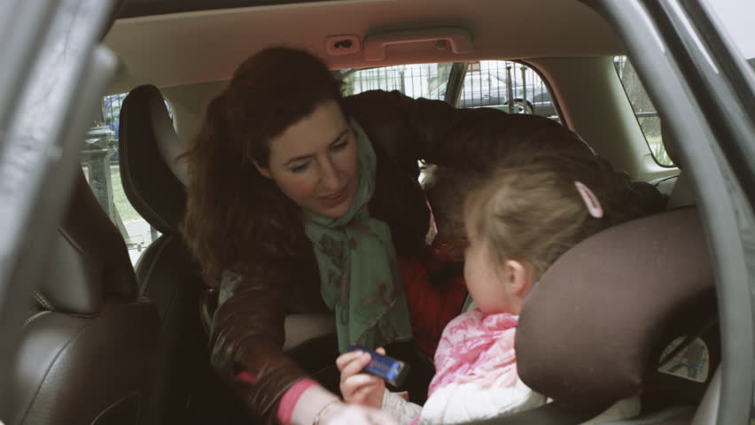 girl playing harmonica mother fastening girl's Stock Footage Video (100 ...